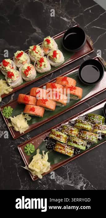 Close-up of delicious Japanese sushi rolls served fresh on a plate in a ...