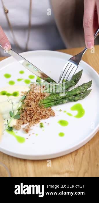 Guests enjoying delicious food in a stylish restaurant. Close-up shots ...
