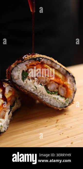 Close-up of delicious Japanese sushi rolls served fresh on a plate in a ...