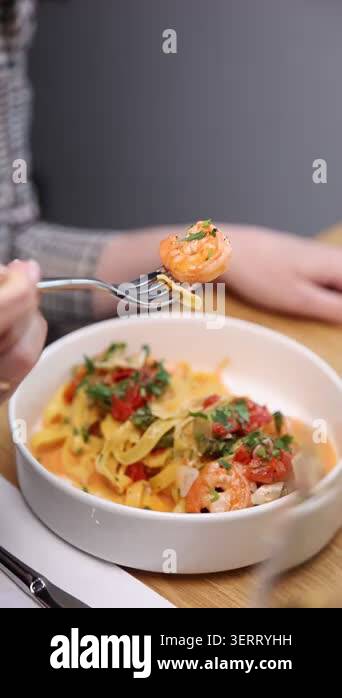 Guests enjoying delicious food in a stylish restaurant. Close-up shots ...