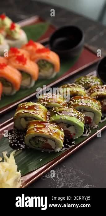 Close-up of delicious Japanese sushi rolls served fresh on a plate in a ...