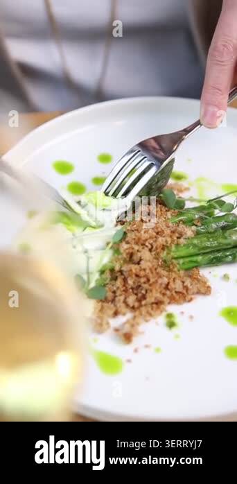 Guests enjoying delicious food in a stylish restaurant. Close-up shots ...