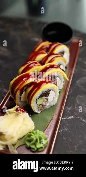 Close-up of delicious Japanese sushi rolls served fresh on a plate in a ...
