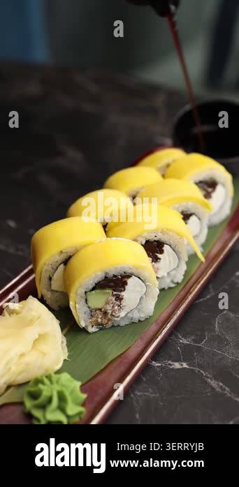 Close-up of delicious Japanese sushi rolls served fresh on a plate in a ...