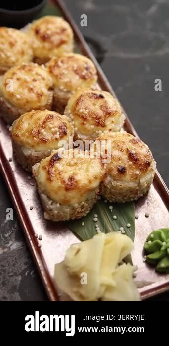 Close-up of delicious Japanese sushi rolls served fresh on a plate in a ...