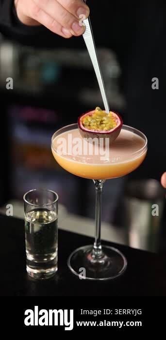 Bartender preparing a signature cocktail in a stylish moody bar Stock ...