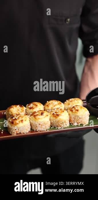 Close-up of delicious Japanese sushi rolls served fresh on a plate in a ...
