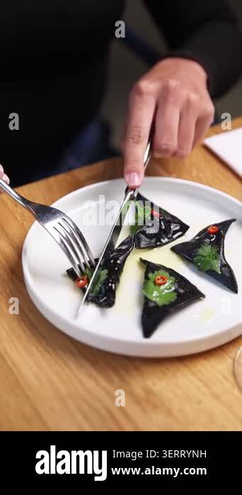 Guests enjoying delicious food in a stylish restaurant. Close-up shots ...