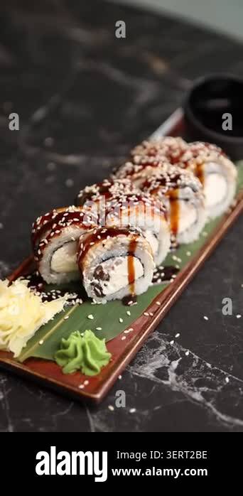 Close-up of delicious Japanese sushi rolls served fresh on a plate in a ...