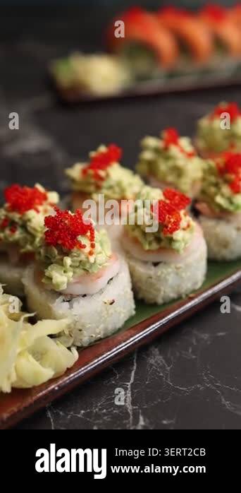 Close-up of delicious Japanese sushi rolls served fresh on a plate in a ...