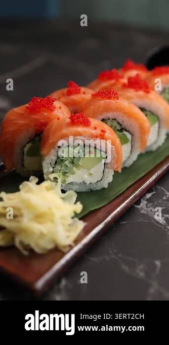 Close-up of delicious Japanese sushi rolls served fresh on a plate in a ...