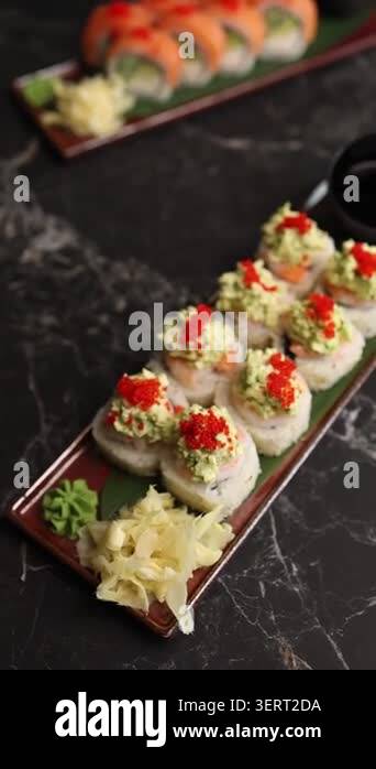 Close-up of delicious Japanese sushi rolls served fresh on a plate in a ...