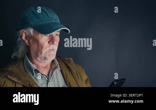 Elderly Old Man Wearing a Hat Makes a Video Call Stock Video Footage ...