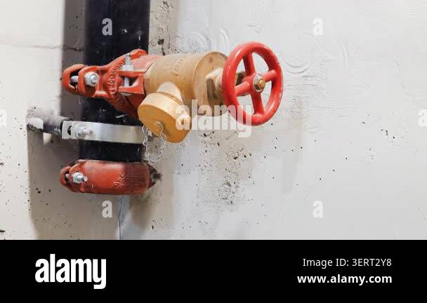 Fire protection standpipe valve with red wheel on pipe Stock Video ...