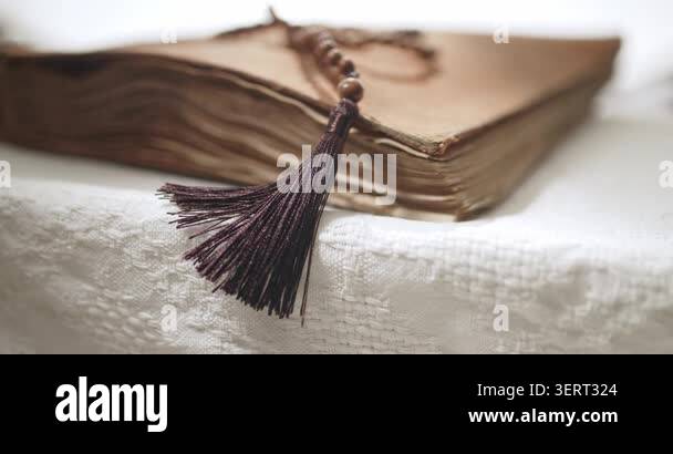 Praying concept video with Quran and beads for spiritual reading and ...
