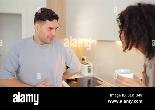 Diverse couple young women and men with coffee in the morning share ...