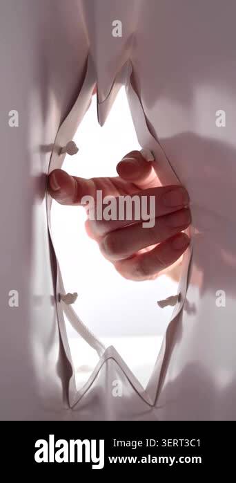 A womans hand reaches into a paper bag. View from the inside Stock ...