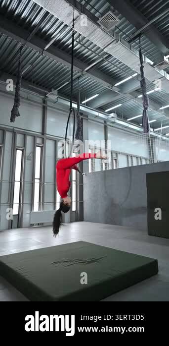 A graceful gymnast trains on an aerial hoop Stock Video Footage - Alamy