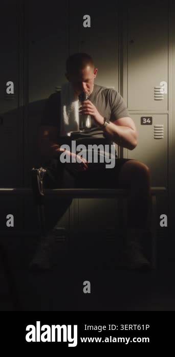 After Training Session, Man Sits on Bench, Soaking in Warm Beam of ...