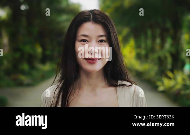 Portrait of Young Asian Woman Looking at Camera Close Up. Head Shot and ...