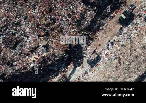 Large Waste Dump and Trash Truck with Garbage in Aerial Top View. Big ...