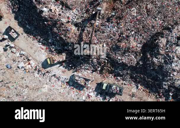 Large Waste Dump and Trash Truck with Garbage in Aerial Top View. Big ...
