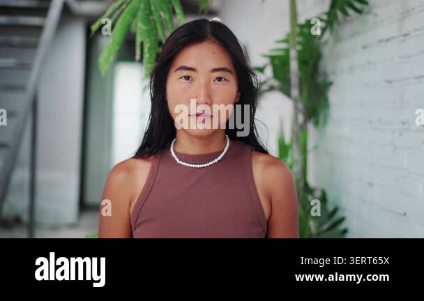 Portrait of Young Asian Woman Looking at Camera Close Up. Head Shot or ...