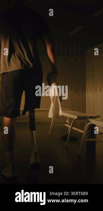 Reality of Hard Work. Tired Man With Prosthetic Leg Sits on Locker Room ...