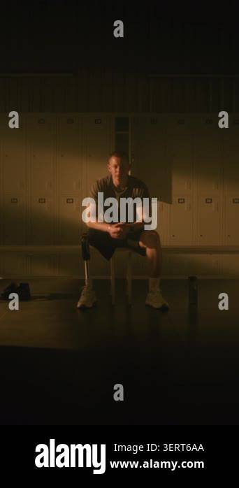 Adaptive Athlete in Dressing Room, Taking Deep Breath, Focusing Mind ...