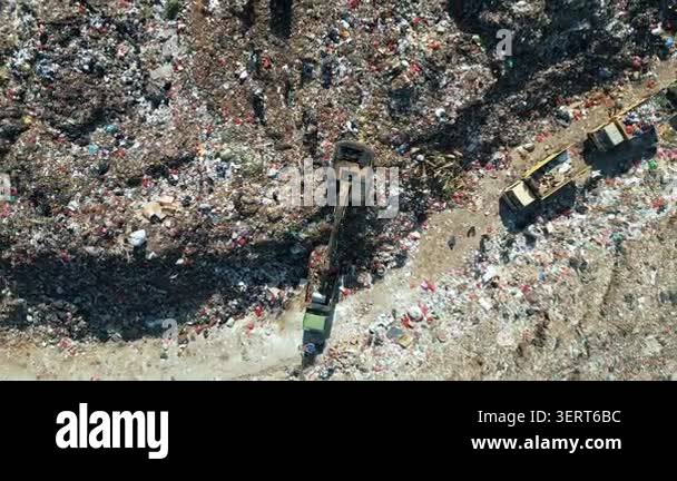 Large Waste Dump and Trash Truck with Garbage in Aerial Top View. Big ...