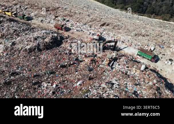 Large Waste Dump and Trash Truck with Garbage in Aerial Top View. Big ...
