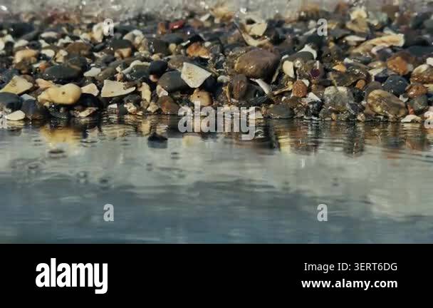 Details of Pebbles Washed by the Sea Waves Stock Video Footage - Alamy