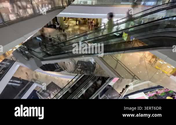 Time Lapse of Shopping People in Retail Mall Moving on Escalator ...