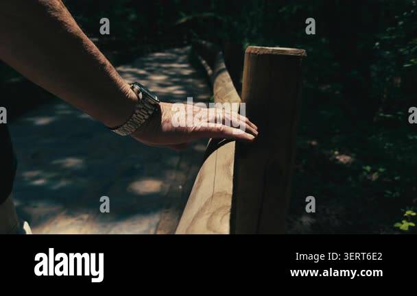 Senior Old Man Walking in Nature Holding On to Wooden Fences Stock ...