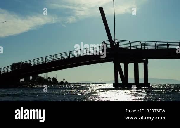 Sport Cyclist Crossing a Bridge Over the Sea at Sunset Stock Video ...