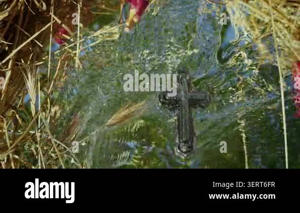 Christian Symbol Cross On Holy Water and The Reflection of Tree Leaves ...