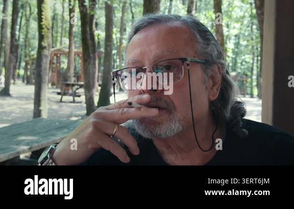 Senior Old Man Smoking Cigarette in Nature Stock Video Footage - Alamy