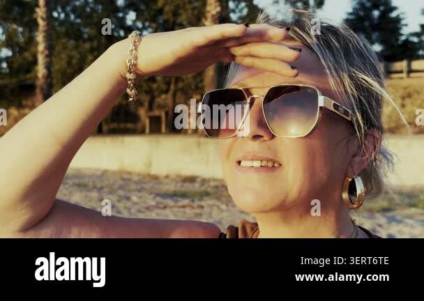 Woman is Looking to the Sunset in Nature Stock Video Footage - Alamy