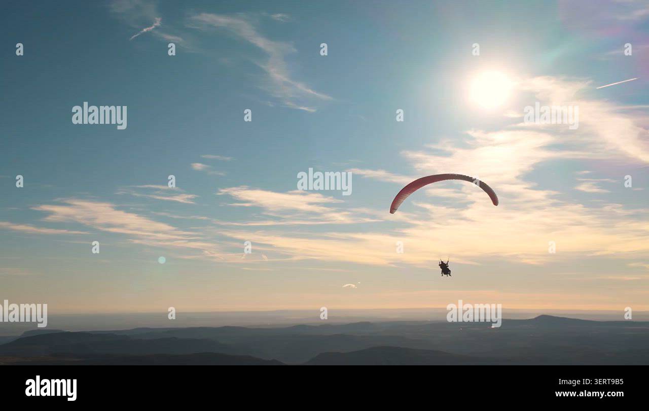 Tandem paragliding during sunny day Stock Video Footage - Alamy