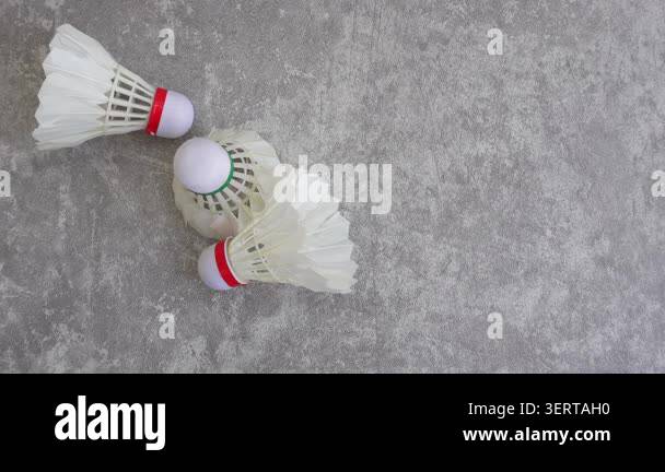 Shuttlecock on abstract gray background Stock Video Footage - Alamy