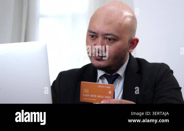 Business Professional Completing an Online Transaction on a Laptop ...