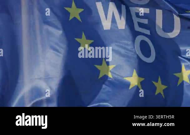 Flag of the western european union organization waving against a clear ...
