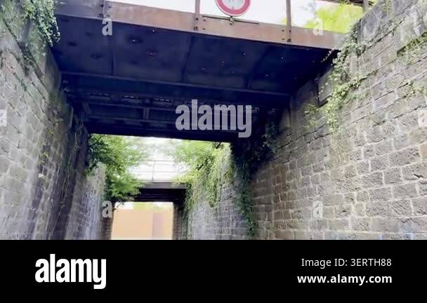 Old stone railway bridge underpass on the disused railway line at ...
