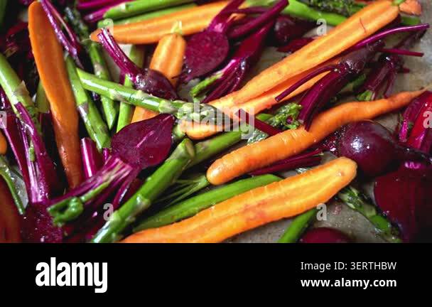 Close-up panning shot of fresh colorful vegetables prepared on a baking ...