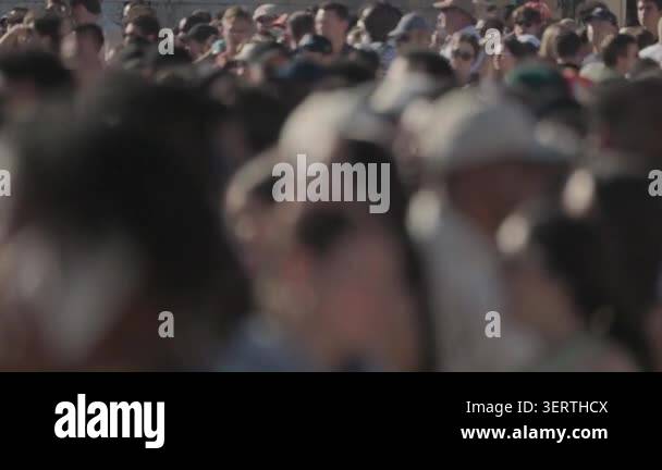 Anonymous crowd of supporters cheering for their national team during a ...