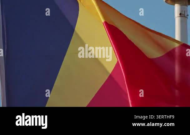 Flags of Romania and other countries flutter in the breeze at a ...