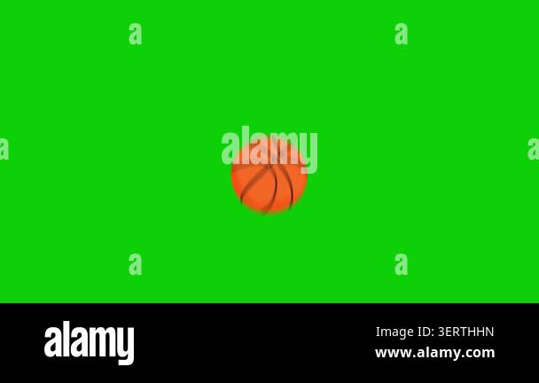 basketball dropping vertically from above toward the ground on green ...
