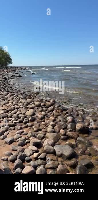 baltic sea shore. beautiful beach with rocks and waves. clear sky ...
