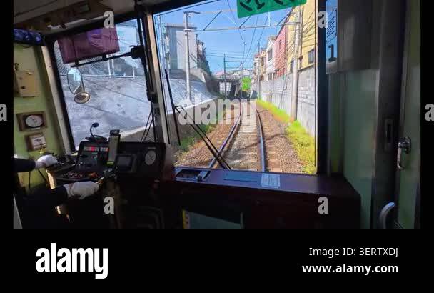 Driver view of Japan's Randen tram moving on tracks, Kyoto's century ...