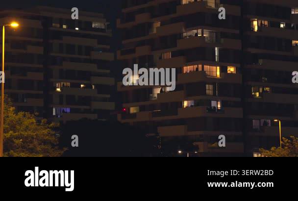 Night view of modern residential apartment towers with illuminated ...